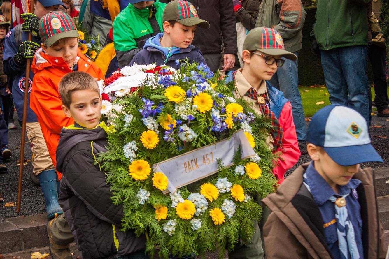 Boy Scouts carry a large floral wreath. - American Battle Monuments ...