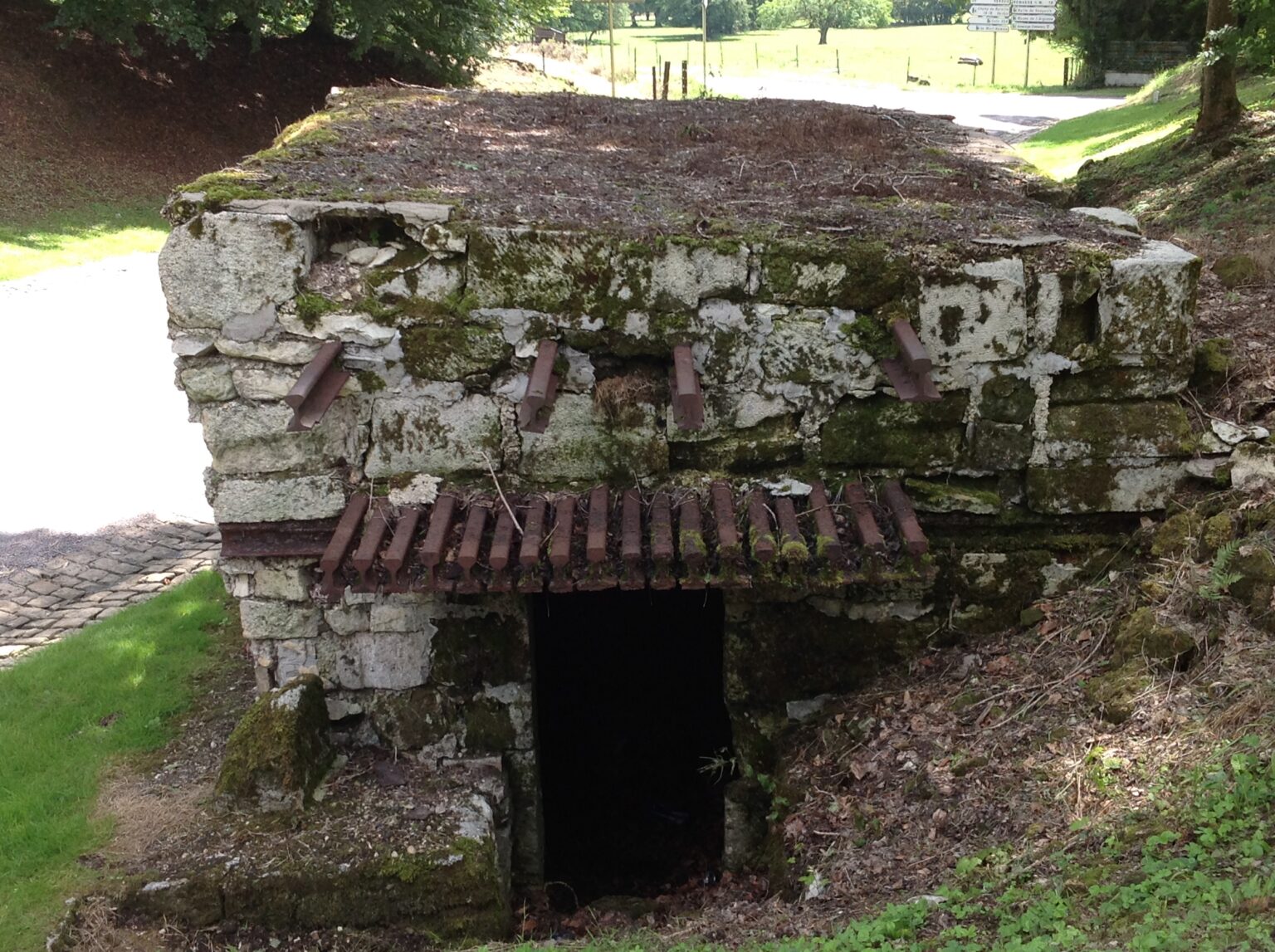 Modern day image showing a German bunker built into the hillside ...